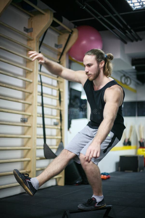 Man working out in a gym. stock photo. Image of people - 98351442