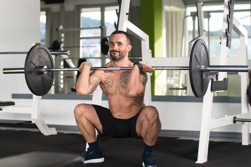Man Doing Heavy Weight Exercise with Barbell Stock Photo - Image of ...