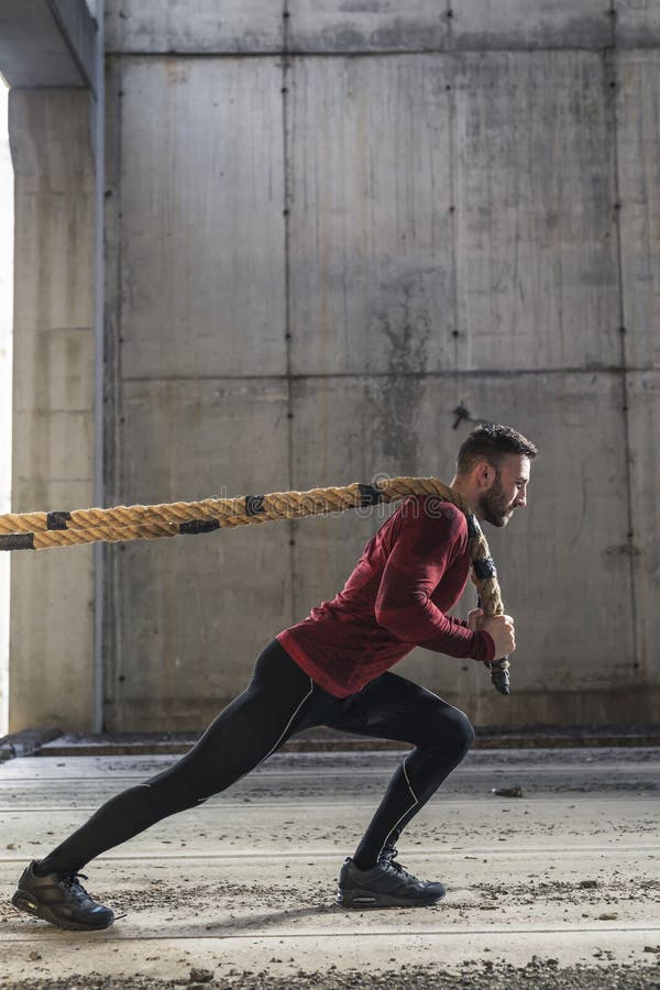 Man Working Out, Pulling Battle Ropes Stock Photo - Image of activity ...