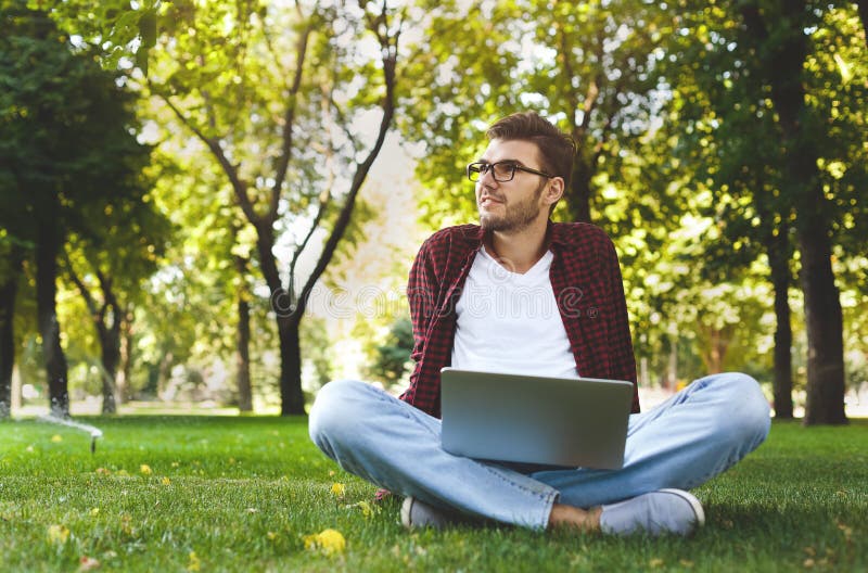 Handsome Young Man Using a Laptop Outdoors Stock Image - Image of ...