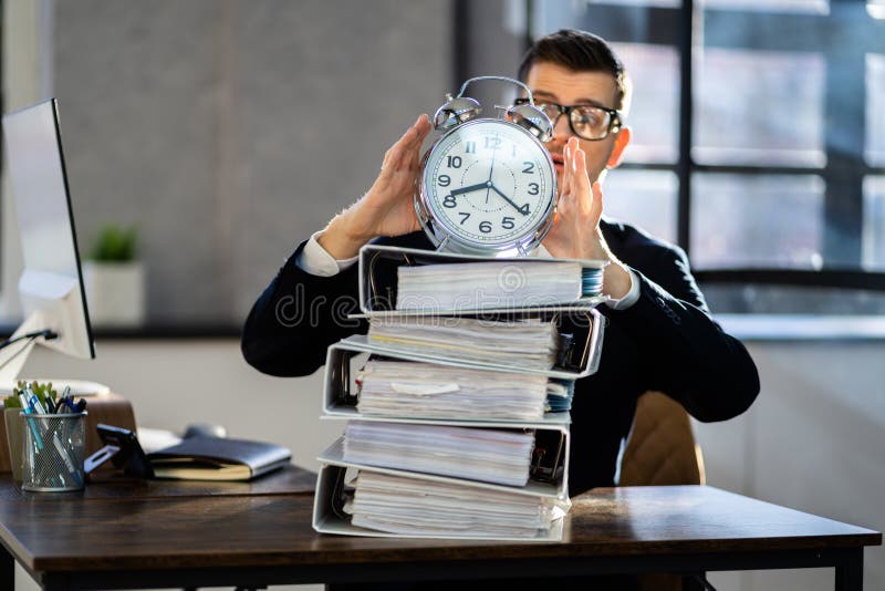 Man Working with Paperwork stock photo. Image of alarm - 241207598