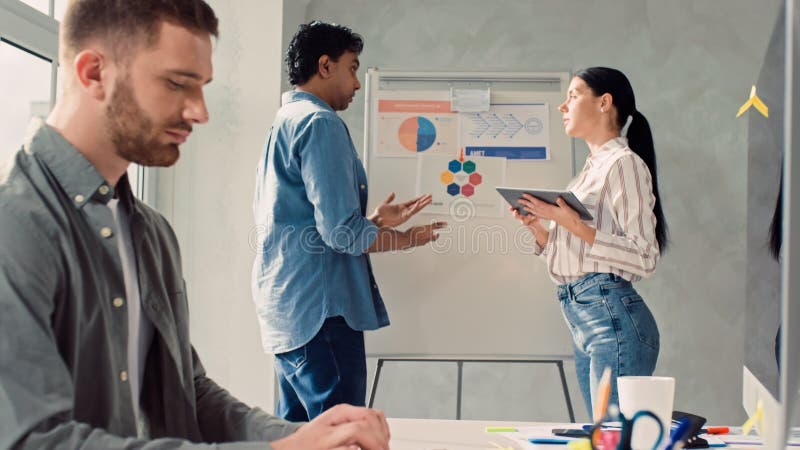 Indian Man Explaning Project To His Team. Creative Team Working at ...