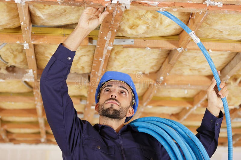 Man Working with Pipe System at Basement Ceiling Stock Image - Image of ...
