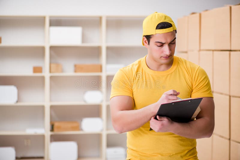 The Man Working in Postal Parcel Delivery Service Office Stock Photo ...