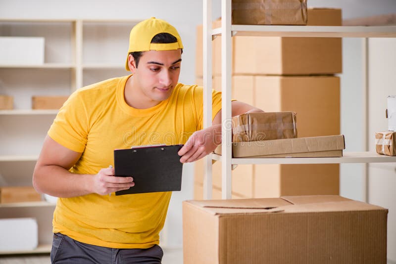 The Man Working in Postal Parcel Delivery Service Office Stock Photo ...