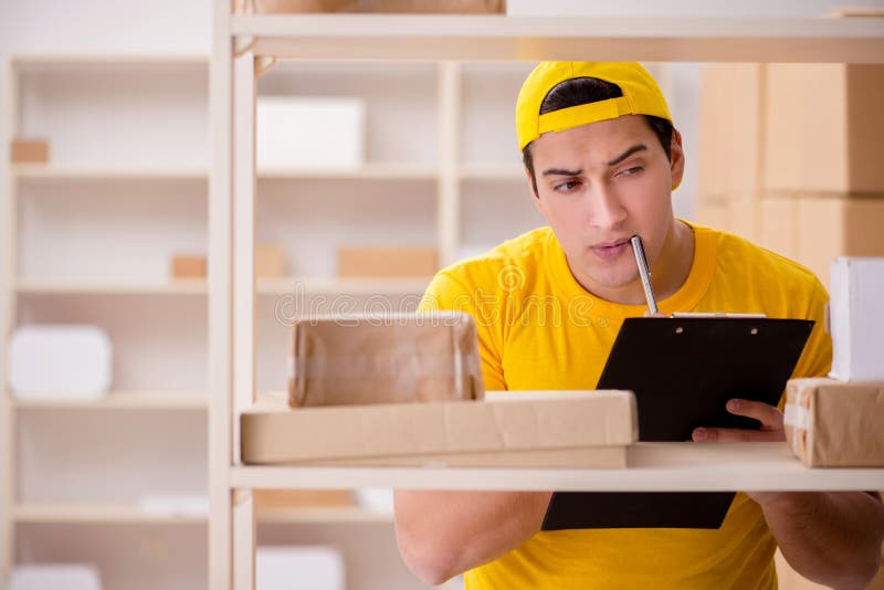 The Man Working in Postal Parcel Delivery Service Office Stock Image ...