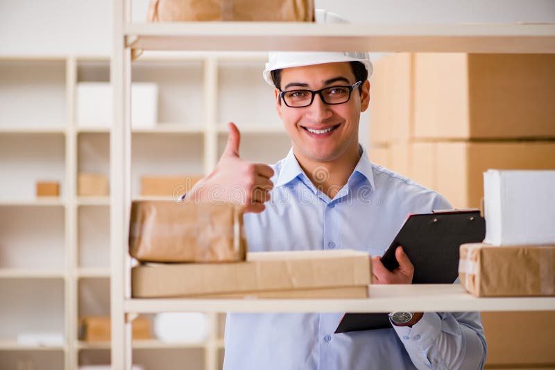 The Man Working in Postal Parcel Delivery Service Office Stock Photo ...