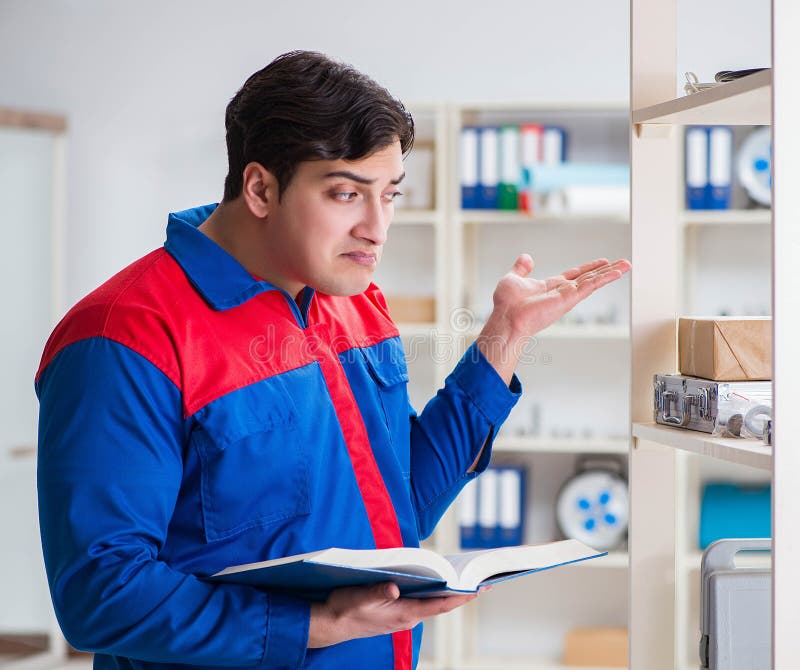Man Working in the Postal Warehouse Stock Photo - Image of book ...