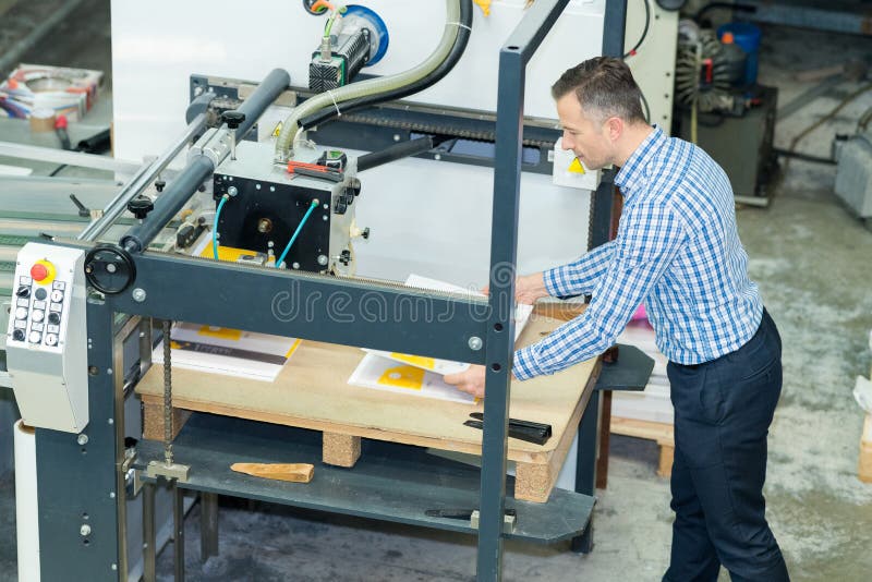 Man Working in Printing Factory Stock Photo - Image of cmyk, screen ...