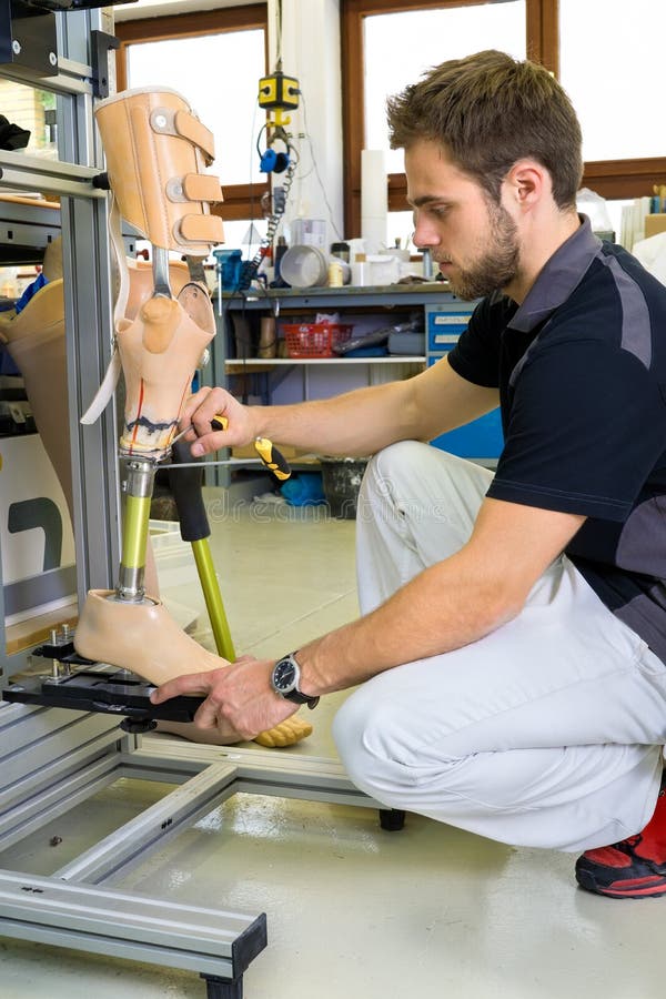 Man Working on Prosthetic Leg Assembly Stock Photo - Image of ...