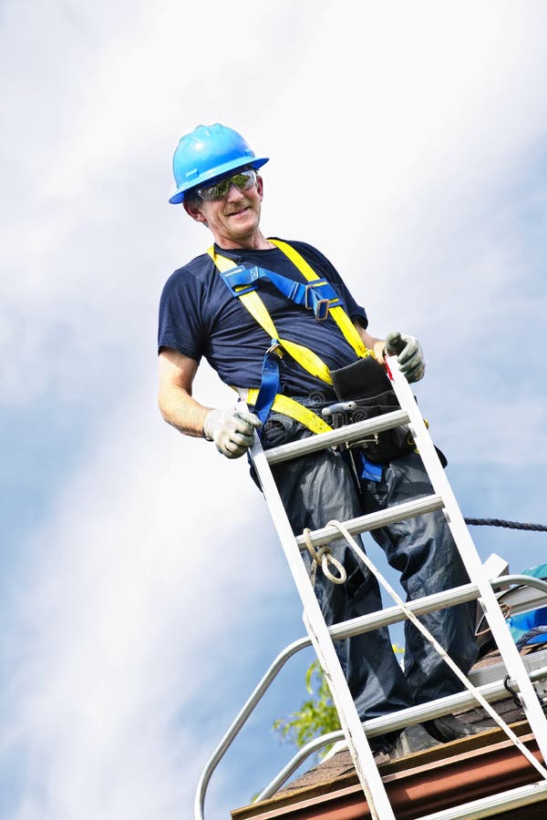 Man working on roof stock image. Image of safety, construction - 16251707