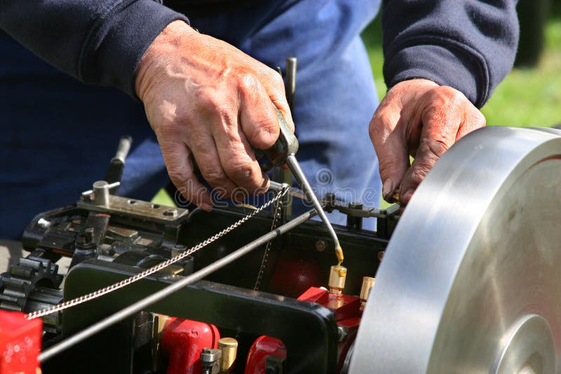 Man Working on Scale Model Steam Powered Traction Engine. Stock Image ...