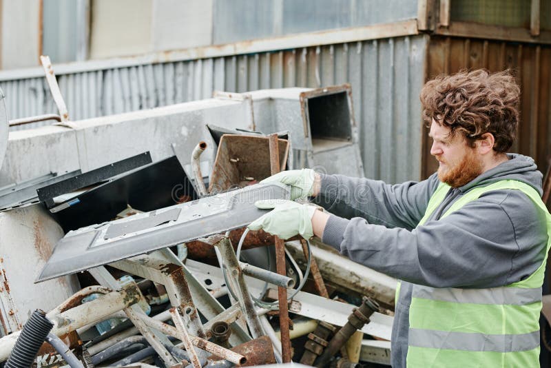 Man Working at Scrapyard stock photo. Image of employee - 268528610