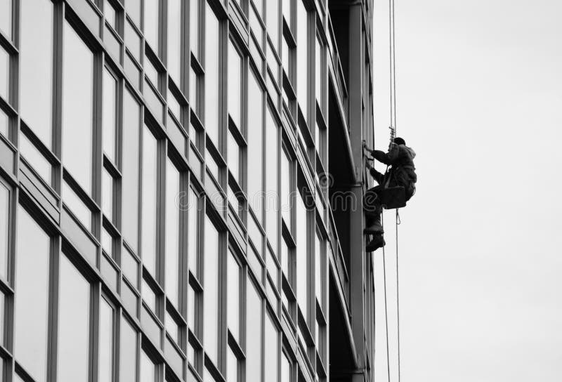 Man Working on Skyscraper stock photo. Image of downtown - 7098094