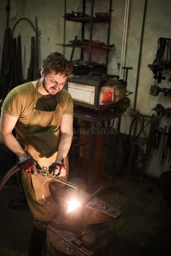 Man working in smithy stock image. Image of smithy, welding - 121882323
