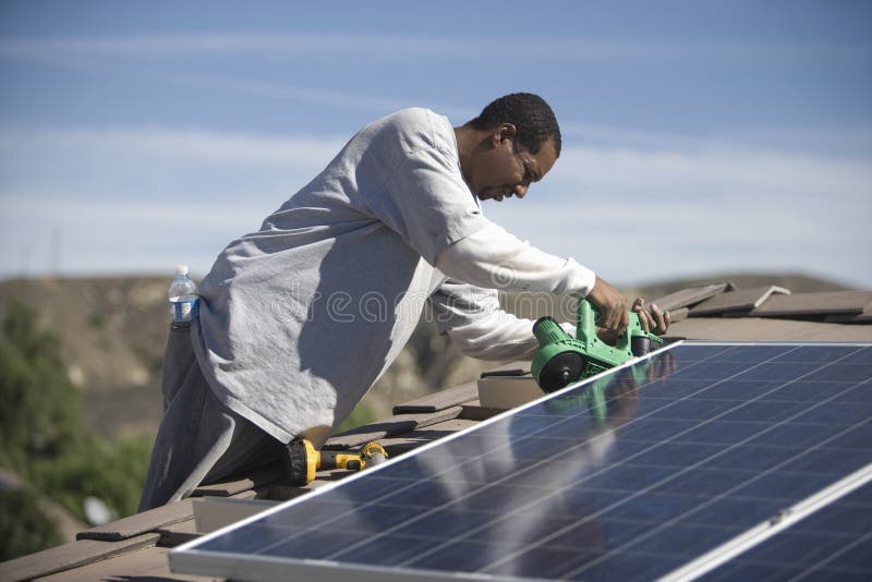Man Fixing Solar Panel on Rooftop Stock Photo - Image of palm ...