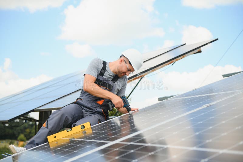 A Man Working at Solar Power Station. Stock Image - Image of cell ...