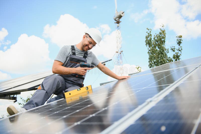 A Man Working at Solar Power Station. Stock Image - Image of house ...