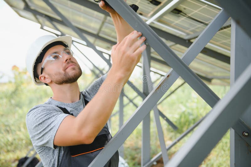 A Man Working at Solar Power Station. Stock Photo - Image of green ...
