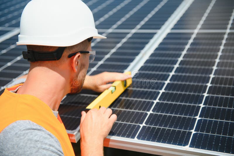 A Man Working at Solar Power Station. Stock Image - Image of blue ...