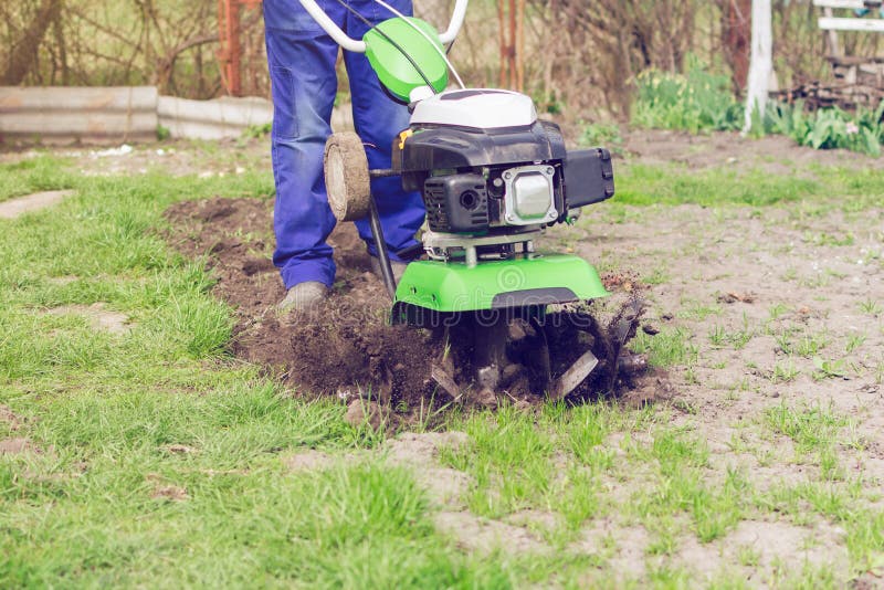 Man Working in the Spring Garden with Tiller Machine Stock Image ...