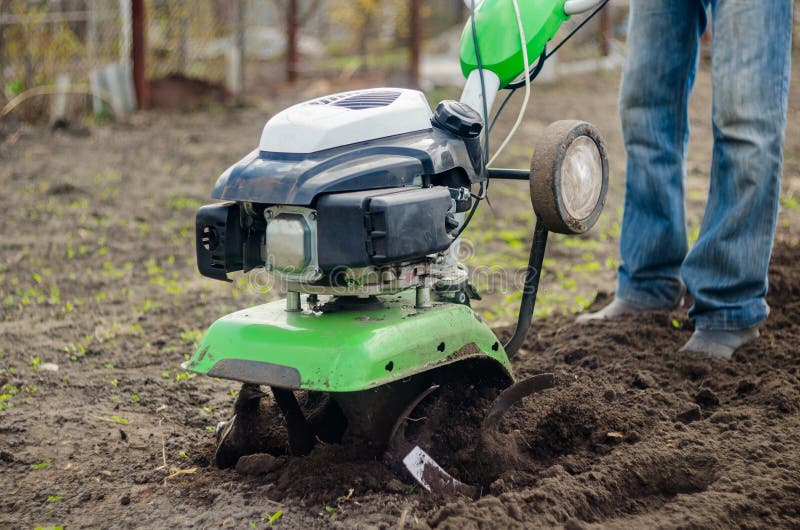 Man Working in the Spring Garden with Tiller Machine Stock Image ...