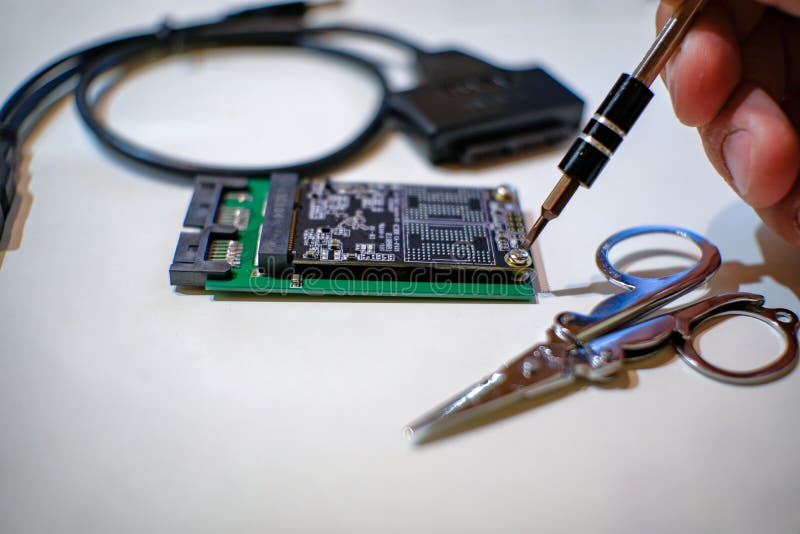 Man Working on Ssd Chipset Computer Components with Screwdriver,tech ...