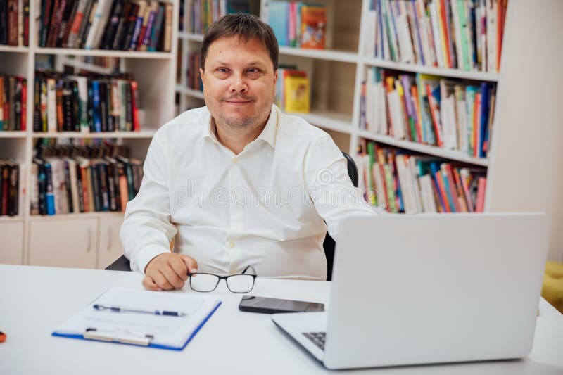 Man Working Studying at Desk with Laptop in University Library Stock ...
