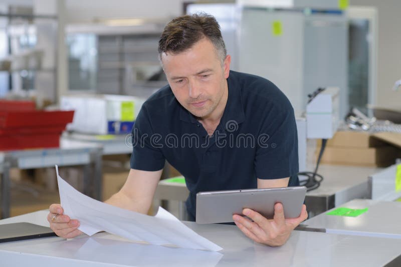 Man working with tablet stock photo. Image of adult - 202443268