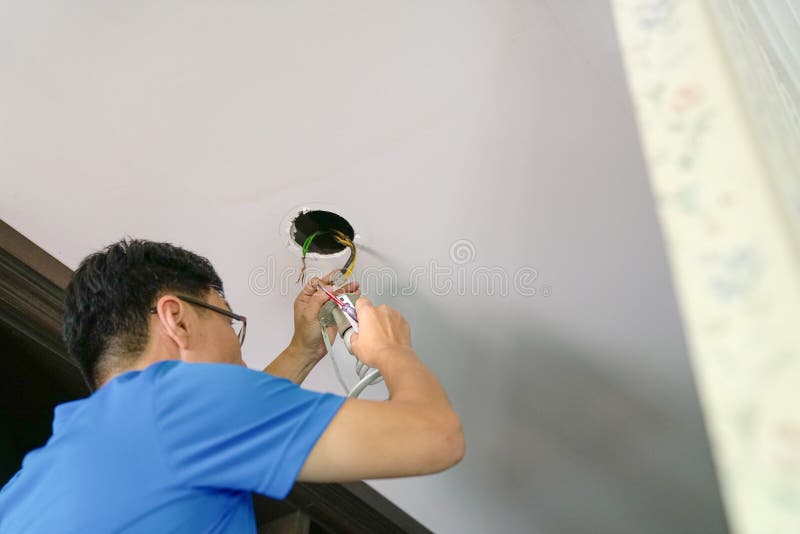 Man Working To Change a Light Bulb Stock Photo - Image of engineer ...