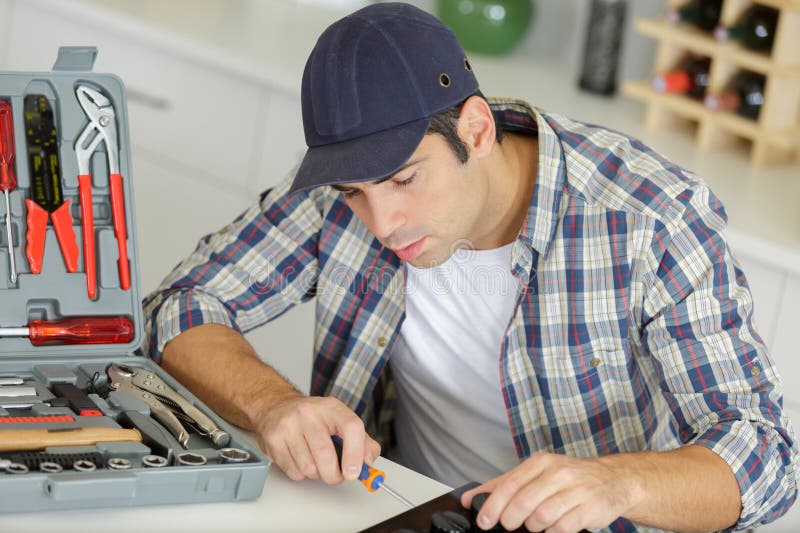 Man working with tools stock photo. Image of tool, problem - 295425520