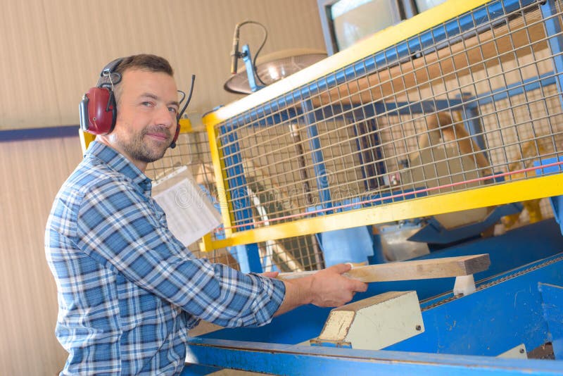 Man Working with Wood Behind Screen Stock Photo - Image of technology ...
