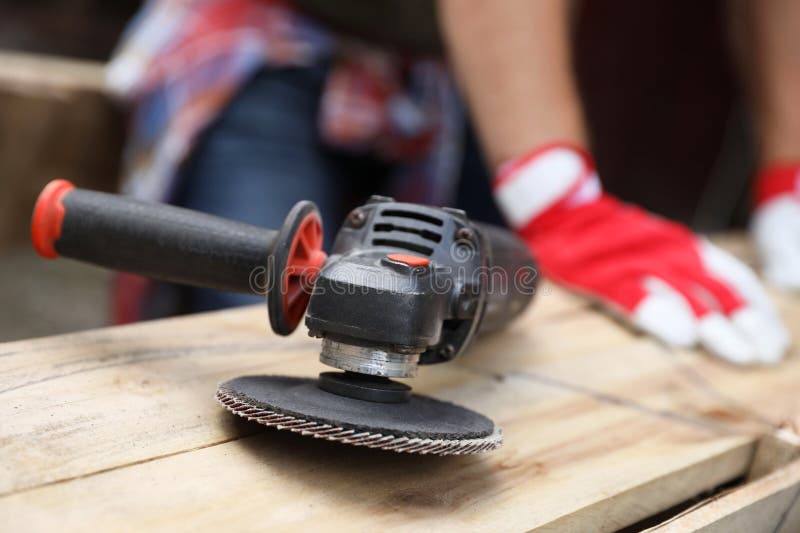 Man Working with Wood Outdoors, Focus on Angle Grinder Stock Image ...
