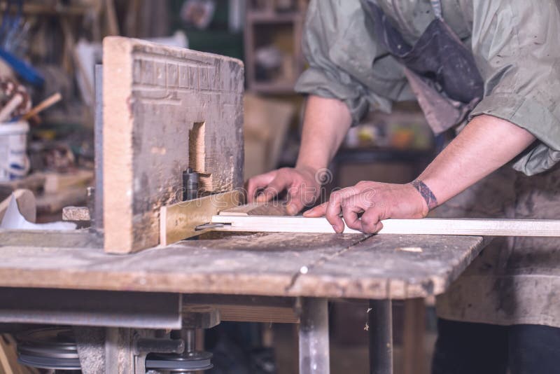 A Man Working with Wood Product on the Machine Stock Photo - Image of ...