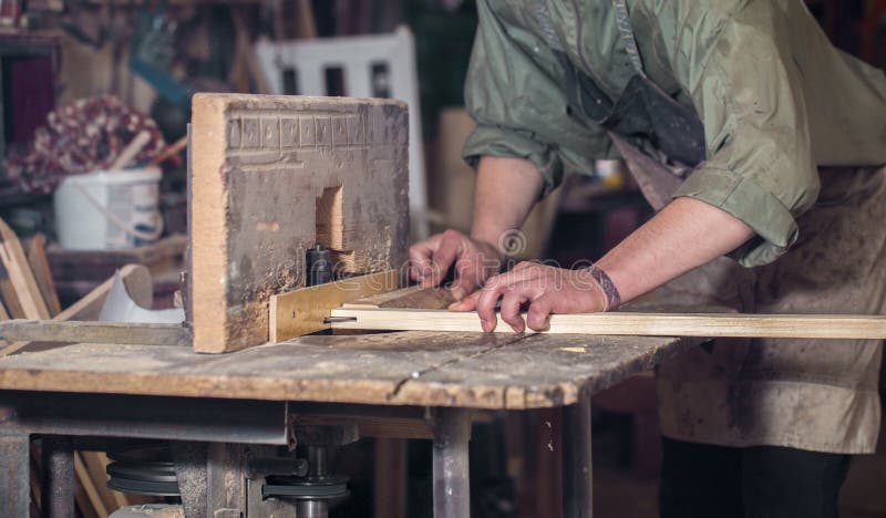 A Man Working with Wood Product on the Machine Stock Image - Image of ...