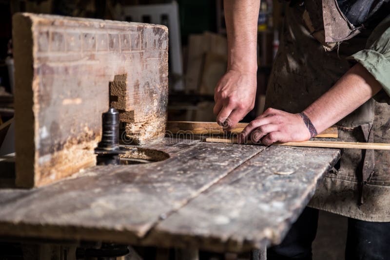 A Man Working with Wood Product on the Machine Stock Photo - Image of ...