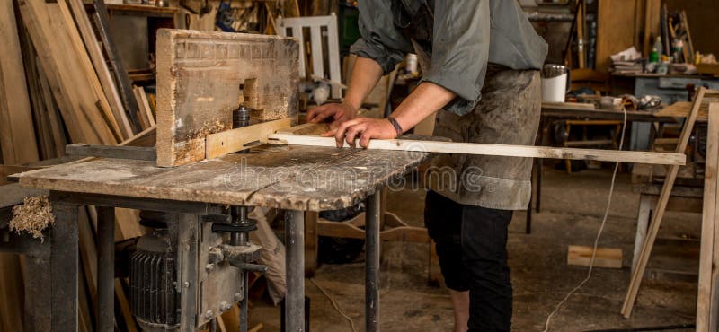 A Man Working with Wood Product on the Machine Stock Image - Image of ...