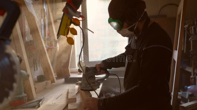 Man Working with Wood in Workshop Using Sanding Machine Stock Footage ...