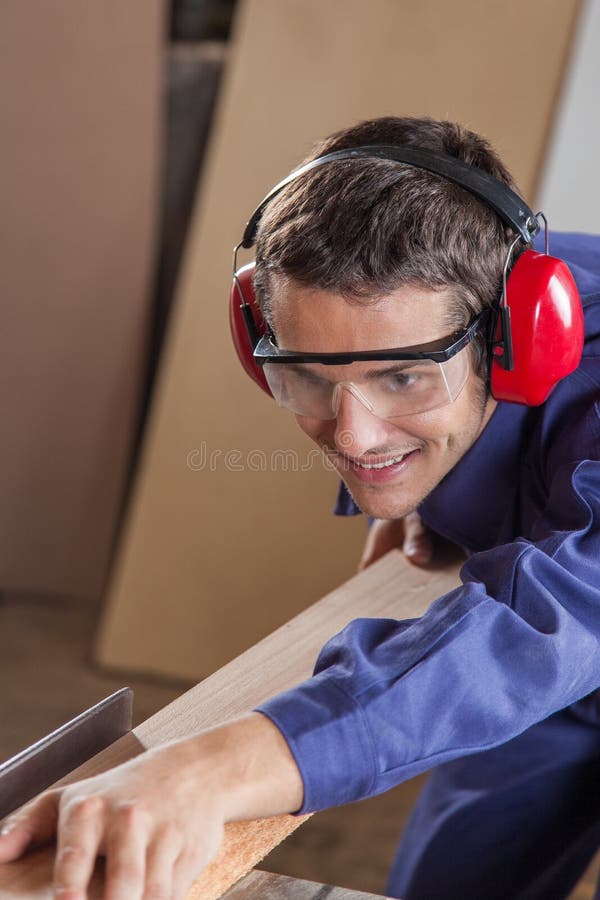Man working with wood stock image. Image of renovation - 65260471