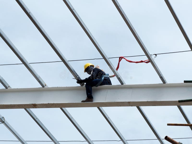 Man Working on the Working at Height on Construction Stock Photo ...