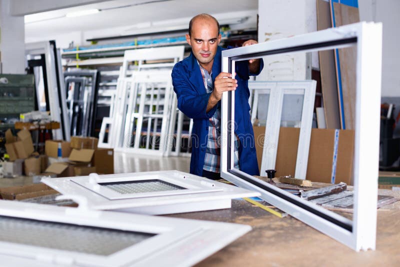 Man Working in Workshop for Assembling Plastic Windows Stock Image ...