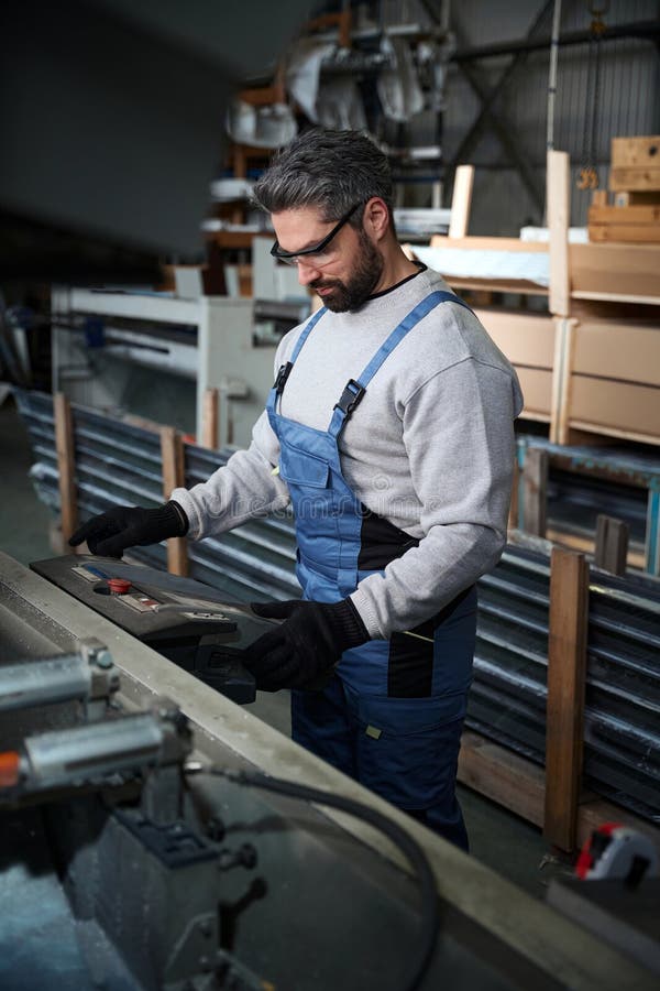 Man at the Workplace in a Production Workshop Stock Photo - Image of ...