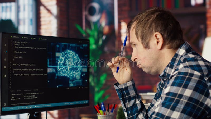 Man Works with AI Deep Neural Networks, Rubbing Forehead with Pen ...