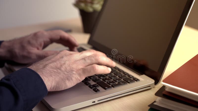 Man Works for a Computer in the Office or at Home Online. Hands Behind ...