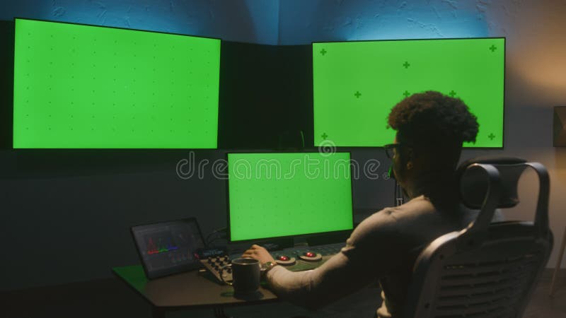 A Man Works on Computer in Studio with Equipment Stock Image - Image of ...