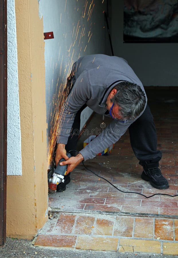 A Man Works with a Corner Grinder Stock Image - Image of trail ...