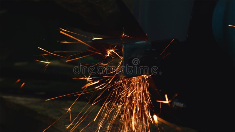 Man Works Grinder in Workshop Spitting Out Sparks Stock Image - Image ...