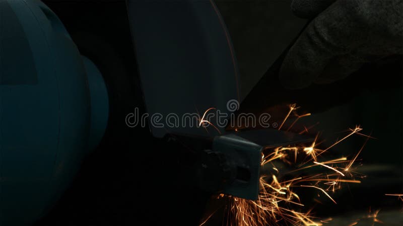 Man Works Grinder in Workshop Spitting Out Sparks Stock Image - Image ...