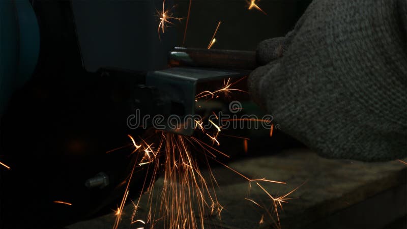 Man Works Grinder in Workshop Spitting Out Sparks Stock Photo - Image ...