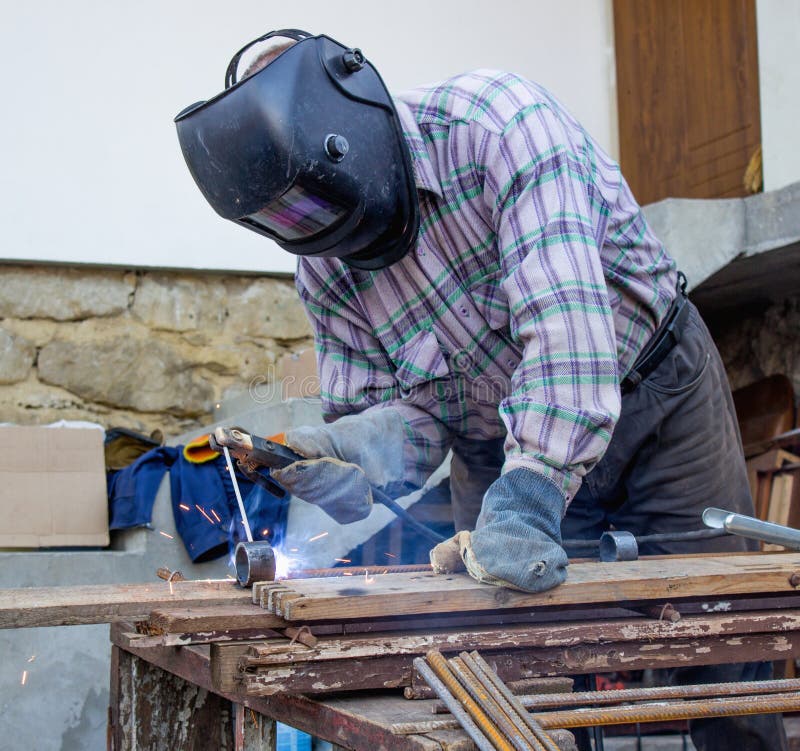 Work in the Industry. a Man Works with a Welding Machine Stock Image ...